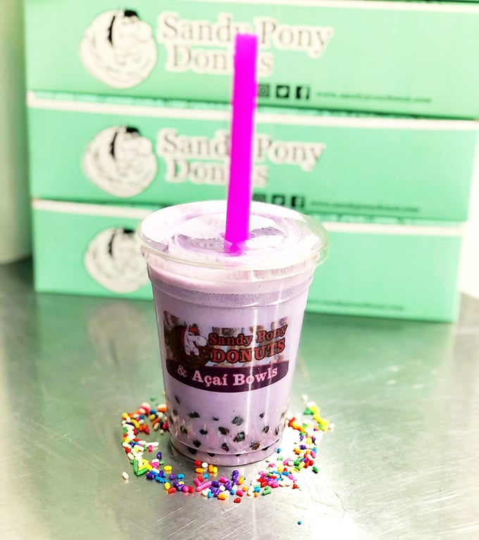 Bubble tea with the perfect purple hue, surrounded by a sprinkle moat. It's like drinking a beach sunset, only sweeter and with chewy surprises.
