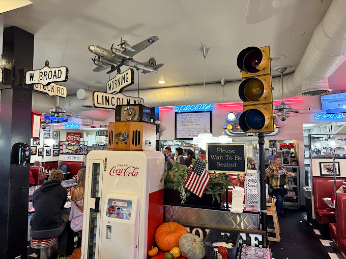 Traffic lights, street signs, and vintage Coca-Cola &ndash; not the d&eacute;cor of a restaurant but the artifacts of American dining history.