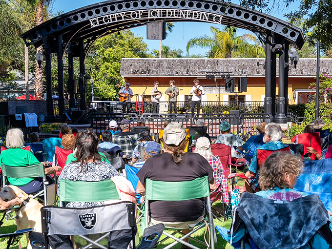 Live music under the gazebo draws locals with folding chairs and coolers &ndash; Dunedin's version of a community living room where everyone's invited.