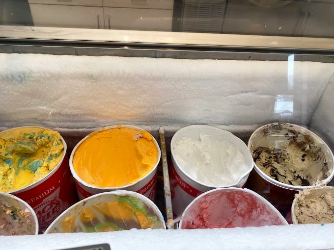 Ice cream flavors lined up like edible paint swatches, each promising its own unique journey from spoon to soul.