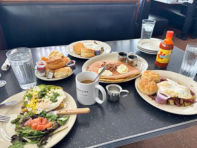 Breakfast spread that could make a rooster oversleep. Each plate tells its own delicious story in this tabletop family reunion.