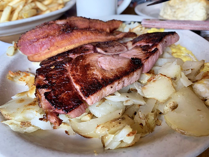 That ham steak isn't playing around. It's the breakfast meat equivalent of showing up to a knife fight with a broadsword.