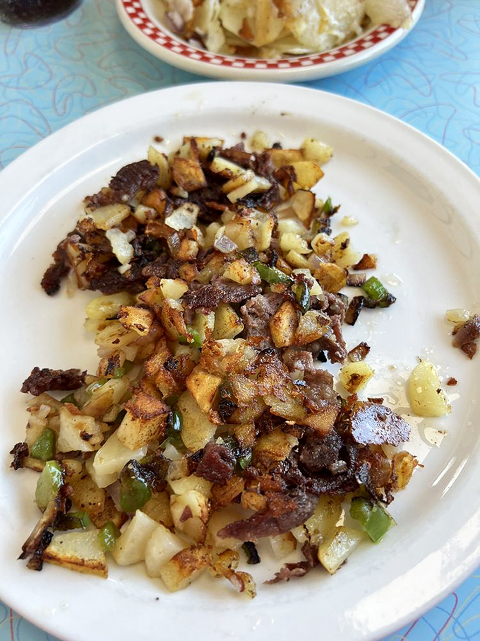 Hash browns aren't just a side dish here &ndash; they're a crispy, golden art form studded with peppers and onions that would make a potato proud.