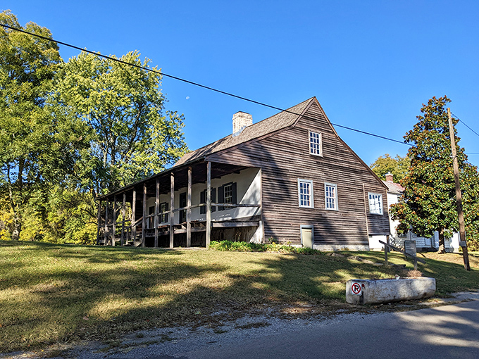 This vertical log home stands as a testament to French colonial architecture, where 18th-century building techniques created structures that have outlasted empires.