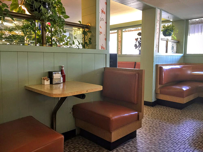 Plants, paneling, and privacy—these booths offer the perfect balance of coziness and "I can still see what everyone else ordered" visibility.