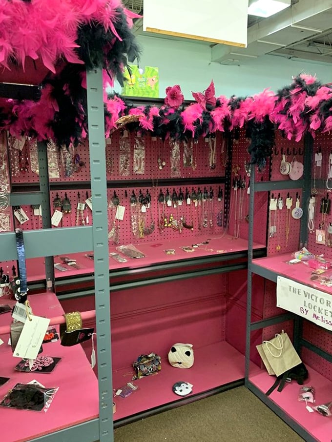 Pink feather boas frame this jewelry booth like the entrance to a treasure cave. Somewhere in here is the perfect statement piece you didn't know you needed.