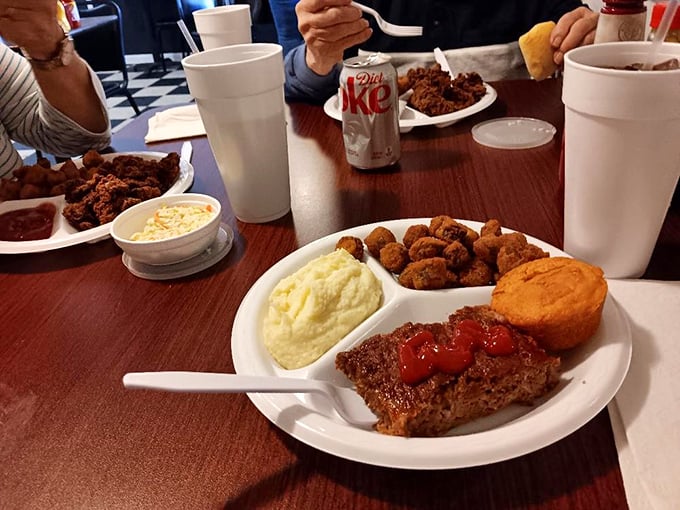 Meatloaf with a ketchup crown, mashed potatoes, and cornbread&mdash;the holy trinity of diner comfort that transcends generations.