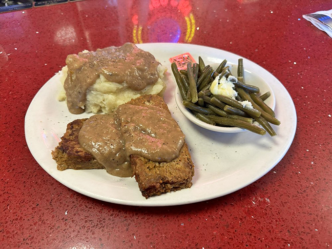 Meatloaf that would make your grandmother both jealous and proud, swimming in gravy that should be classified as a controlled substance.