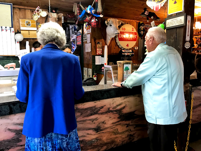 Where the magic happens &ndash; ice cream dreams come true at this counter, complete with a tiny decorative pig standing guard over sweet treasures.