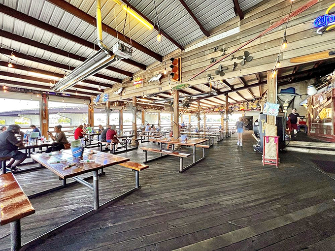 Al fresco dining with a side of lake breeze. The covered outdoor seating area offers panoramic views that enhance every bite.