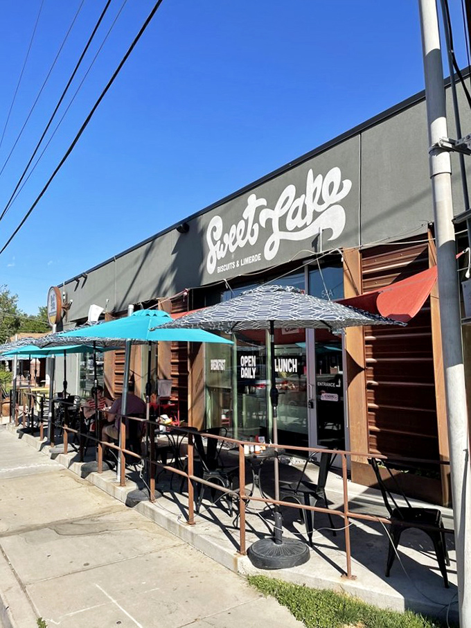 Outdoor seating that invites you to people-watch while your taste buds have their own adventure under those cheerful turquoise umbrellas.