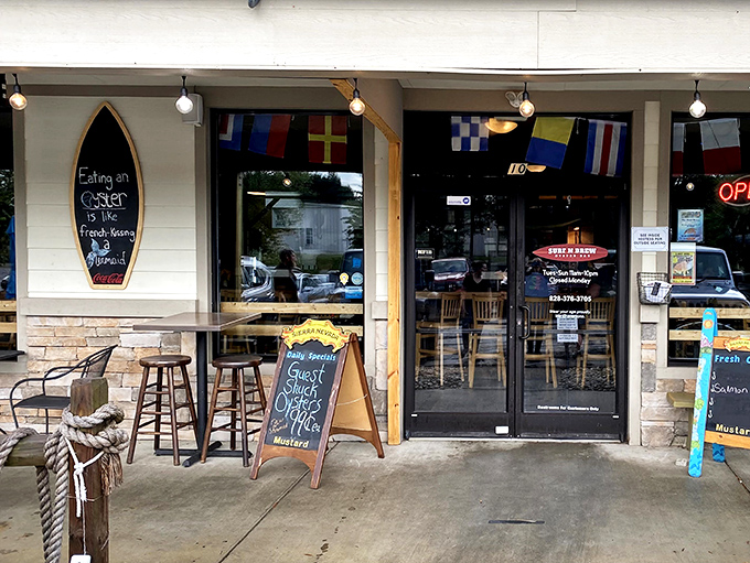 A surfboard sign reminds you that "Eating on the Coaster is the Fresh Ocean Approach" &ndash; coastal philosophy delivered in mountain air.