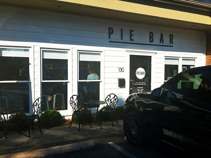 The storefront, where 30-minute parking signs remind you that good things don't last forever – except the memory of great pie.