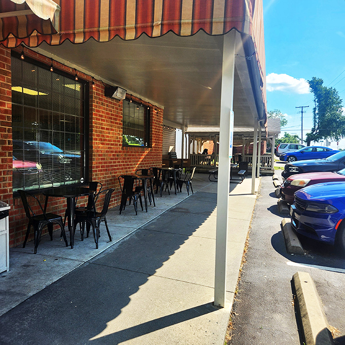 Al fresco dining, country store style. These outdoor tables offer fresh air and the perfect stage for your sandwich performance.