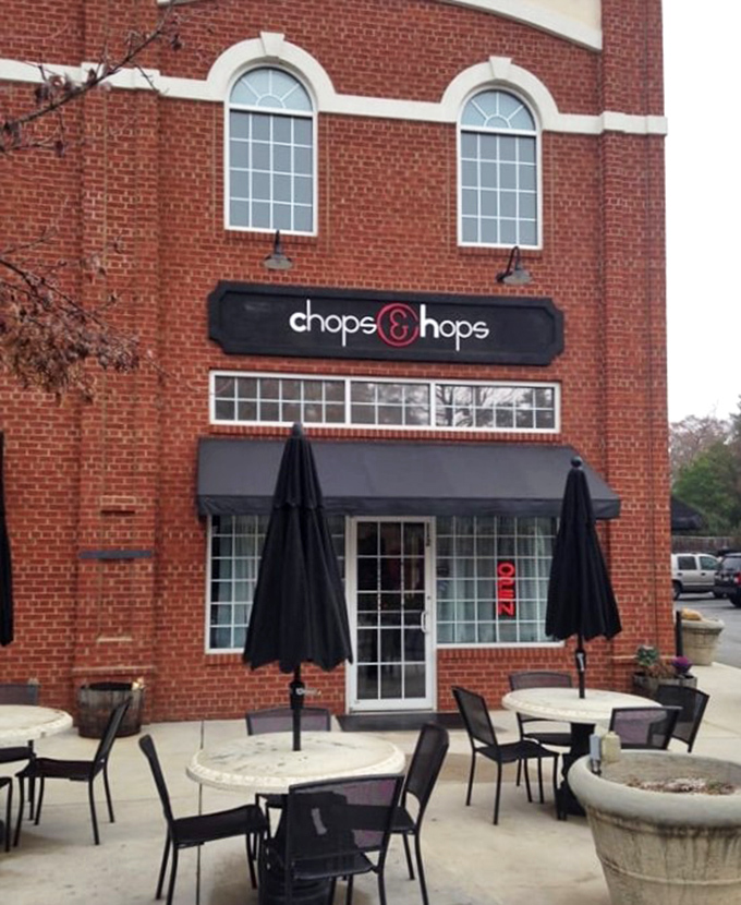 The patio where fresh air makes everything taste better. These tables have witnessed first dates, business deals, and the sacred moment when someone first tastes that house steak sauce.