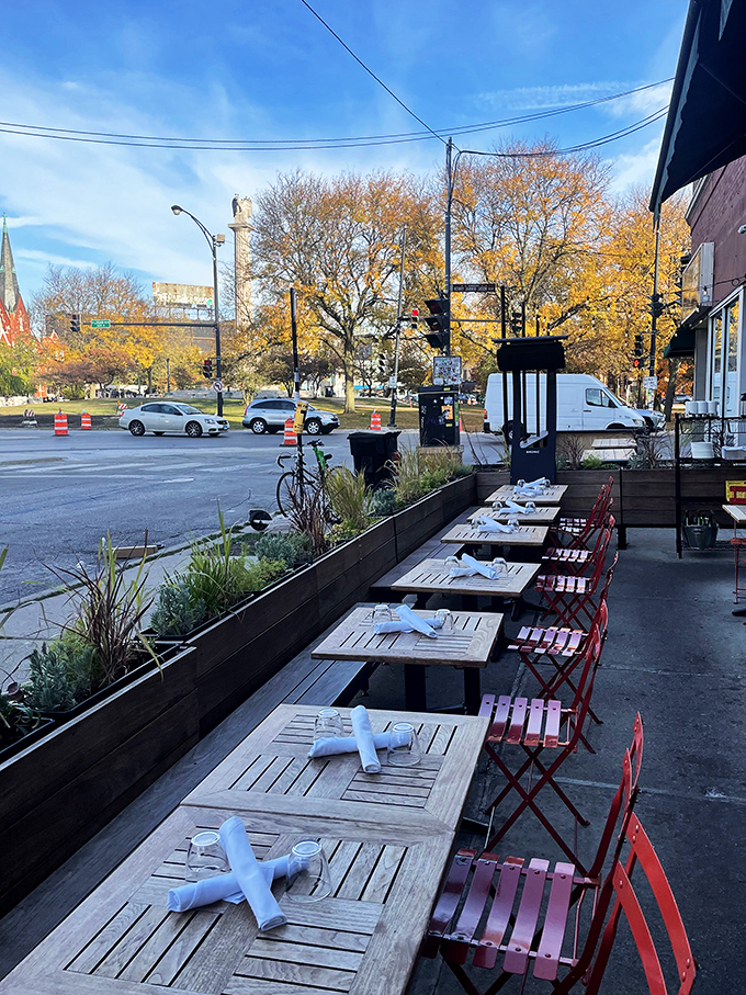Sidewalk dining with a view of Logan Square's leafy boulevard. Those red chairs practically beg you to linger over one more coffee.
