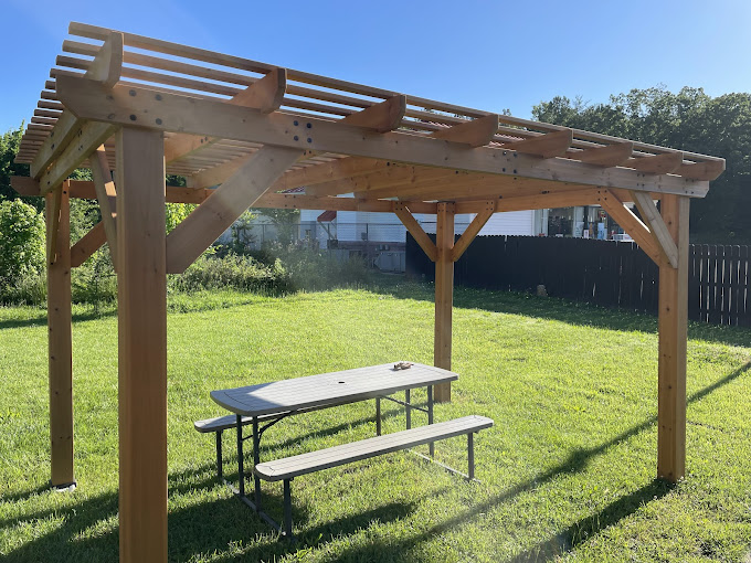 The outdoor pergola offers respite from both sun and indoor seating. Your pupusa deserves fresh air just as much as you do.