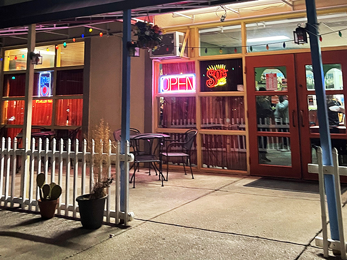 Evening at La Placita transforms the patio into a twinkling oasis. That "OPEN" sign isn't just an invitation&mdash;it's a promise of good things to come.