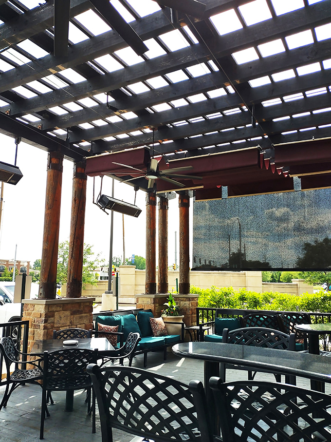 Patio perfection: where fresh air, comfortable seating, and overhead coverage meet to create that "I could sit here all afternoon" feeling.