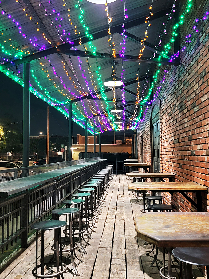 The outdoor patio strings Mardi Gras-worthy lights above wooden planks, creating the perfect spot for summer evening seafood feasts.