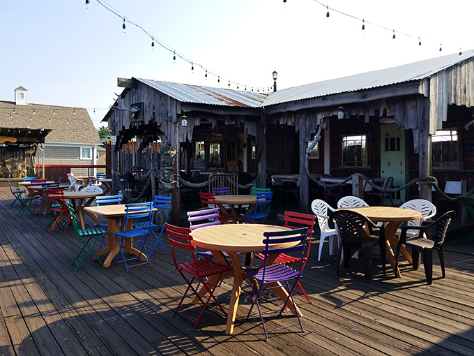 The outdoor deck offers colorful seating where summer breezes complement seafood feasts, making "Ohio" and "oceanside dining" somehow make sense together.