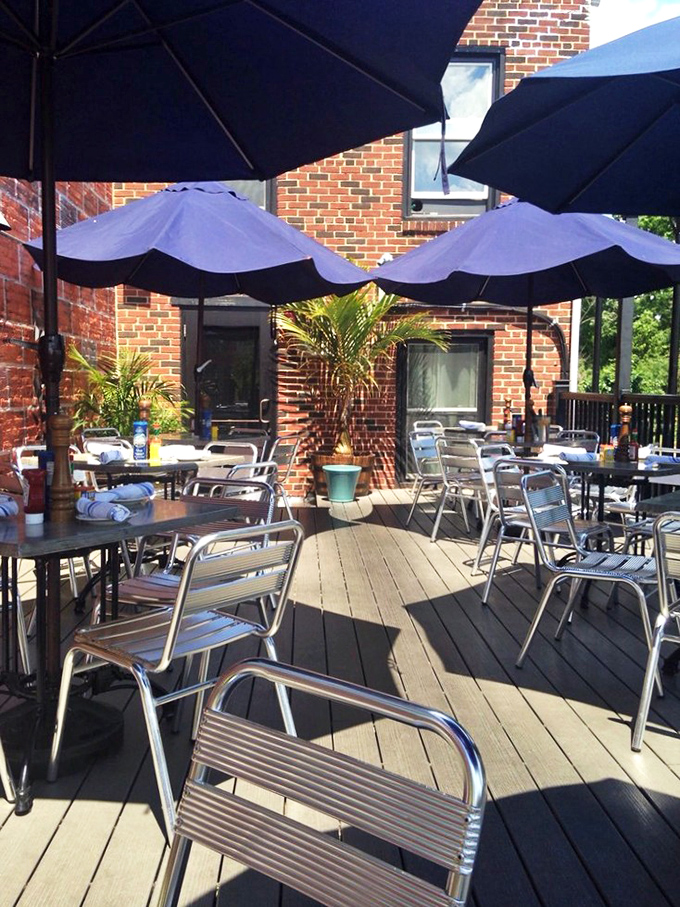 The outdoor patio offers that rare combination of fresh air and fresh seafood, under umbrellas that shield you from everything except good times.