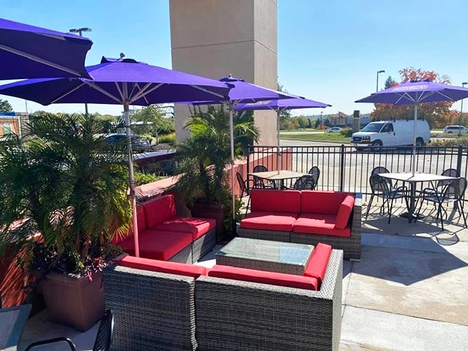 The outdoor lounge looks like it was plucked from a boutique hotel, with those crimson couches offering the perfect perch for people-watching between courses.