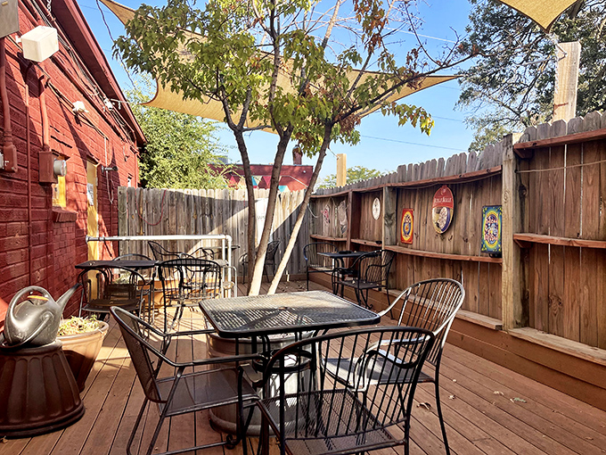 Their charming outdoor patio feels like a secret garden for seafood lovers&mdash;wooden fence, shade sails, and tables perfect for summer evening escapes.
