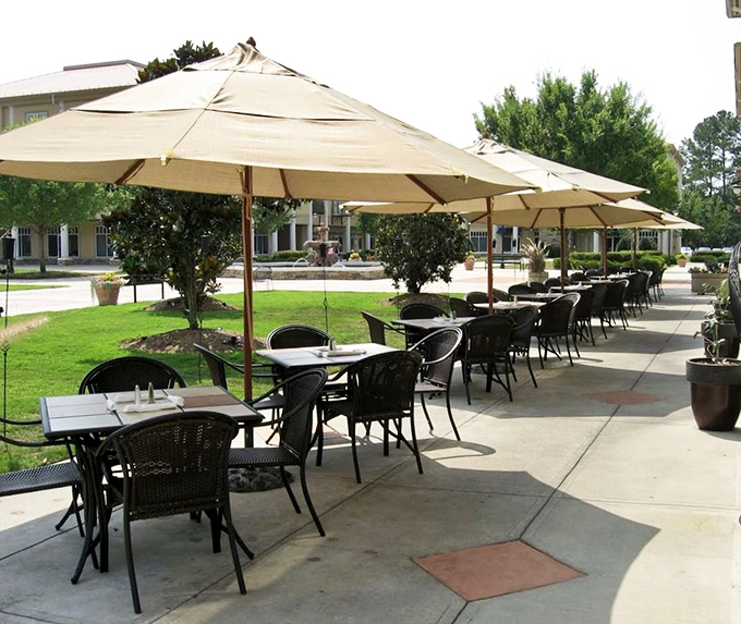 Outdoor seating under cream umbrellas offers a peaceful respite from the indoor buzz, perfect for savoring dessert without judgment.