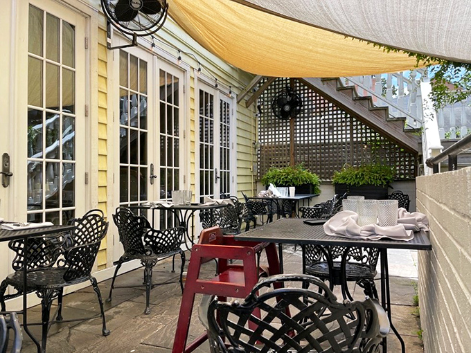 The hidden courtyard patio&mdash;Charleston's answer to secret gardens&mdash;where al fresco dining feels like a delicious conspiracy.