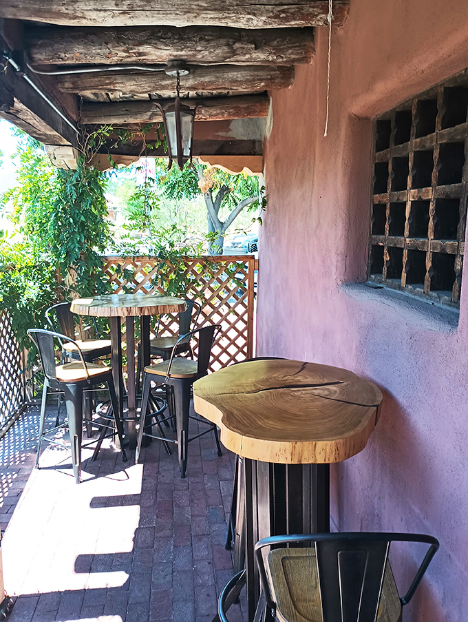 The patio offers dappled sunlight through lattice, adobe walls, and the kind of wooden tables that have heard a thousand "mmms" of culinary delight.