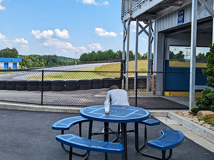 The philosopher's bench – where racers contemplate their line through turn three while pretending to enjoy a refreshing beverage.