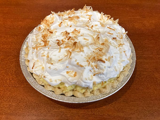 Coconut cream pie wearing its toasted crown with the confidence of dessert royalty&mdash;fork-ready and camera-worthy.