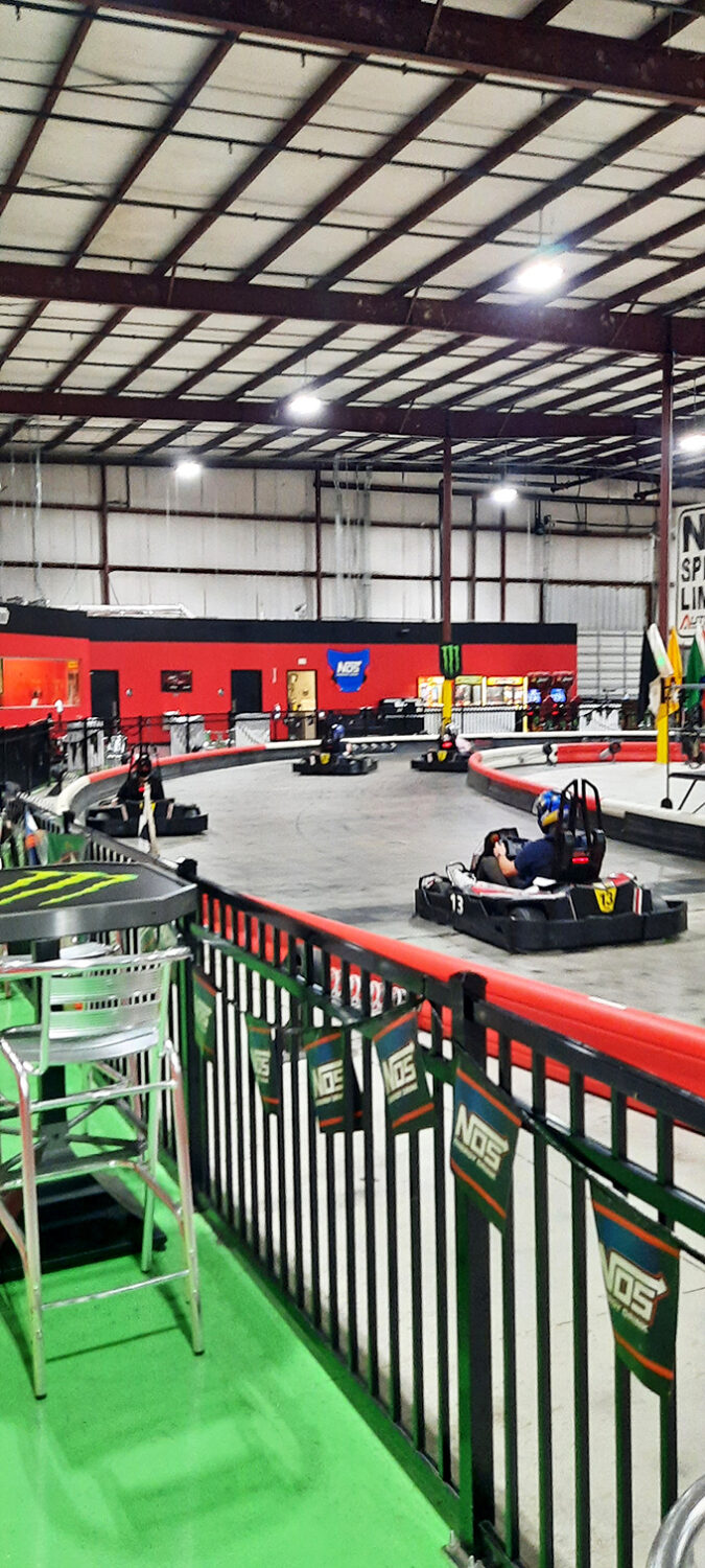 "Just one more lap" faces in their natural habitat. The concentration is palpable&mdash;like chess players, but with horsepower instead of pawns.