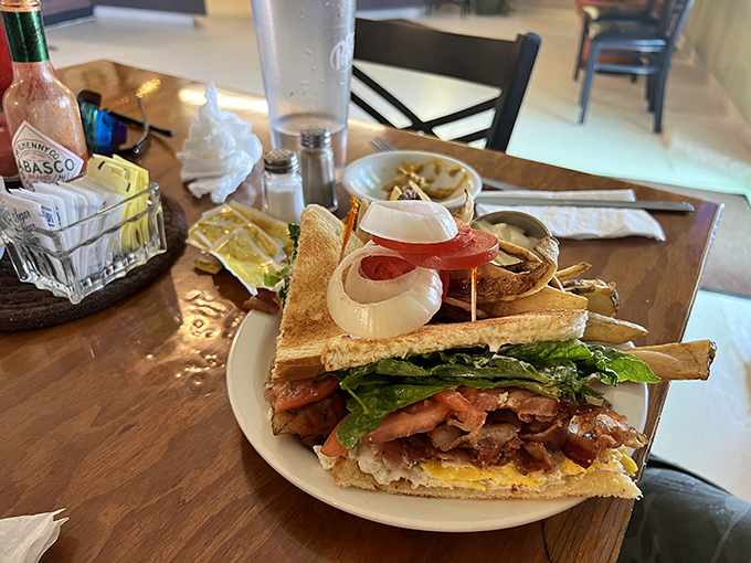 This isn't just a sandwich; it's architectural genius with layers of flavor that would make Frank Lloyd Wright weep with joy.