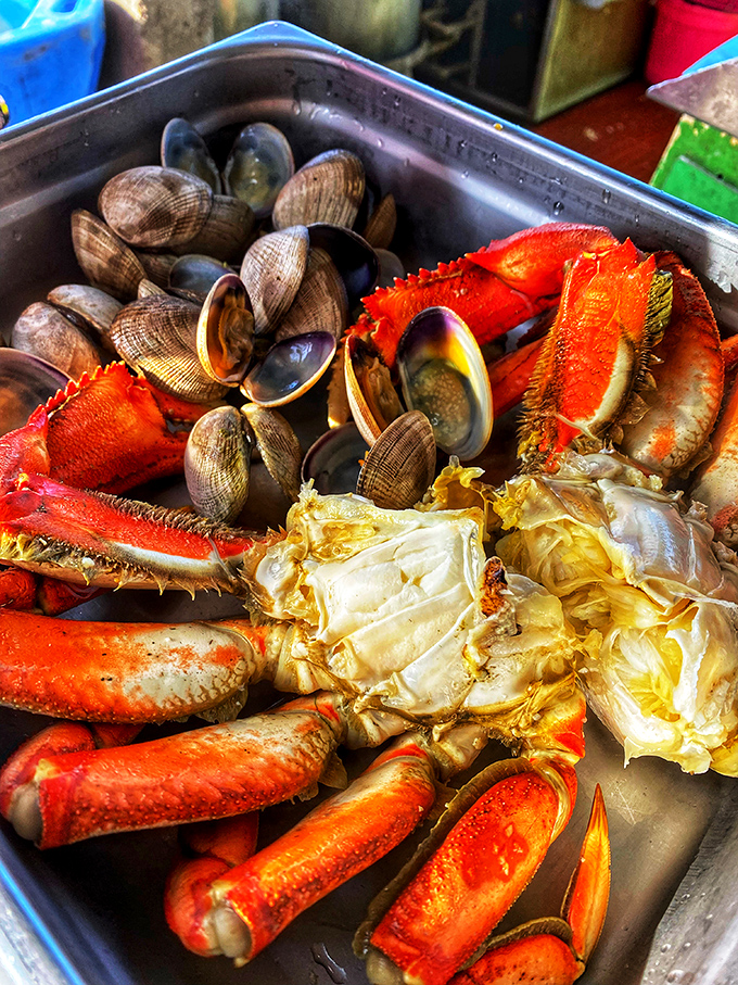 The seafood trifecta: crab, clams, and more crab. When your plate looks like this, silence falls as everyone gets down to delicious business.