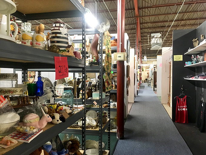 Treasures stacked to the ceiling create narrow pathways of possibility. One person's decluttering is another's decorating inspiration.