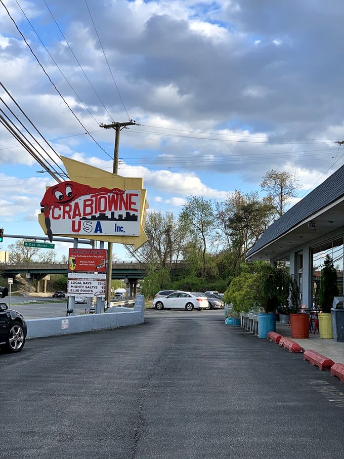 Not all heroes wear capes; some are retro signs with cartoon crabs, guiding hungry travelers to seafood salvation.