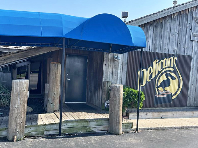 As dusk falls, Pelican's wooden exterior glows with promise, like a lighthouse guiding hungry sailors to comfort food shores.