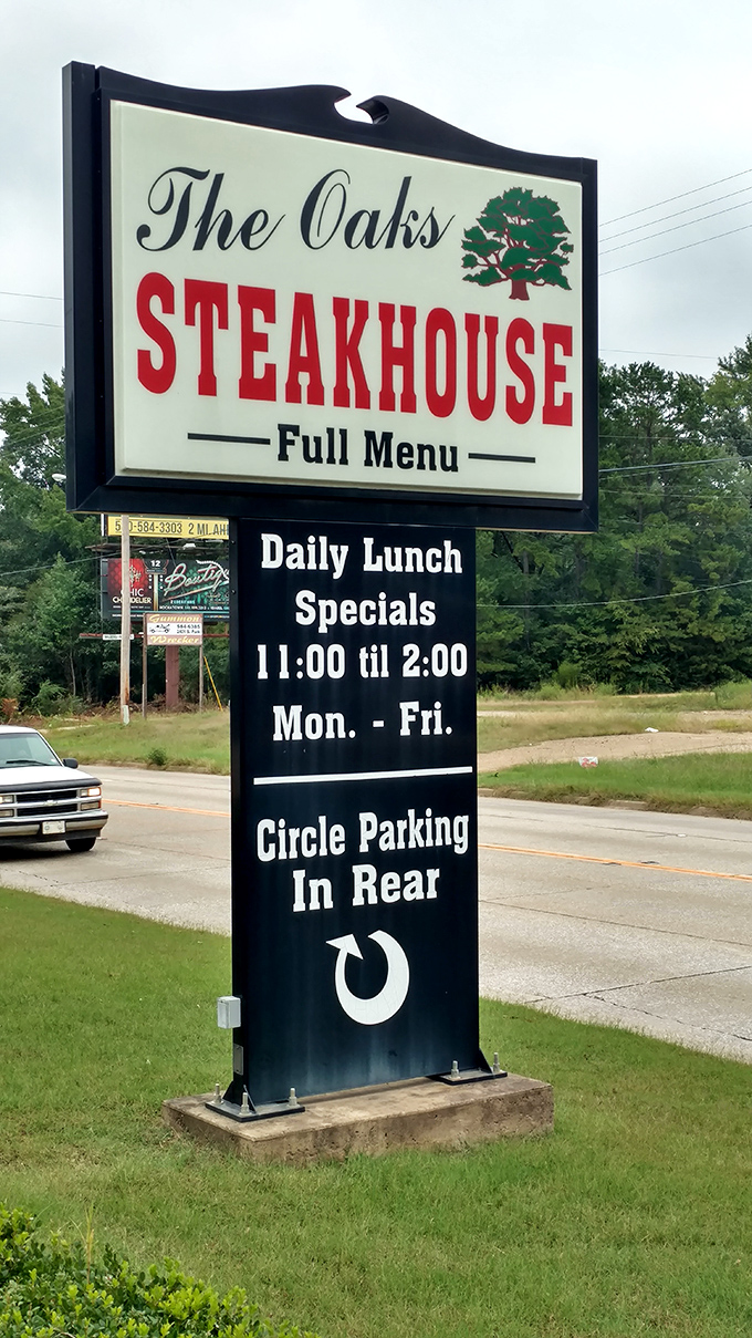 The roadside sign promises steaks and lunch specials with straightforward honesty. No gimmicks needed when your food speaks volumes.