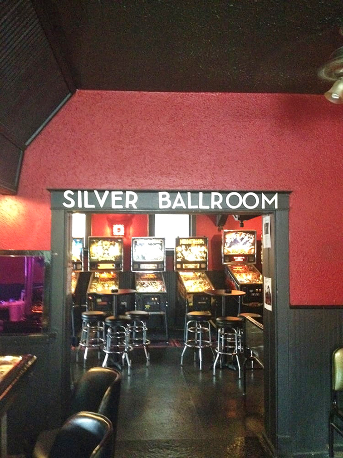 The entryway beckons with retro silver lettering, promising a sanctuary where the ping and buzz of proper pinball awaits the faithful.