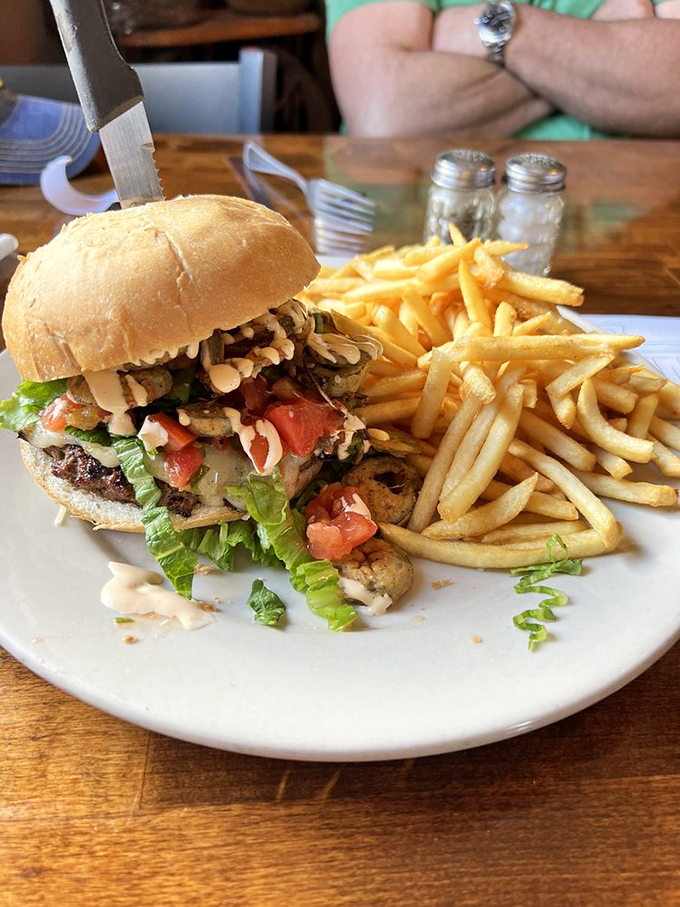 The quintessential American lunch: a burger with personality and fries that could headline their own food festival. Notice how no one's sharing.