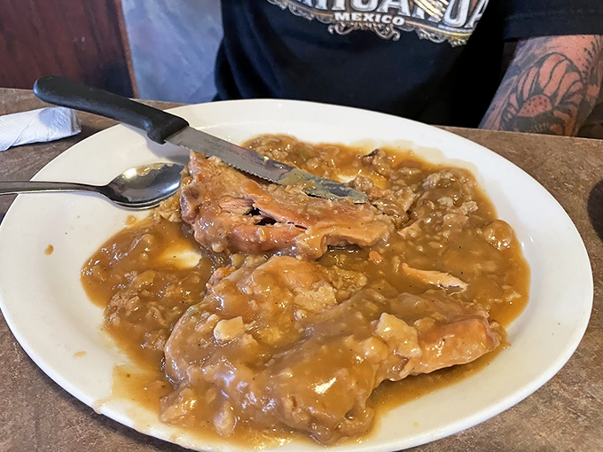 These smothered pork chops aren't just fork-tender&mdash;they're practically begging the fork to come over for a visit.