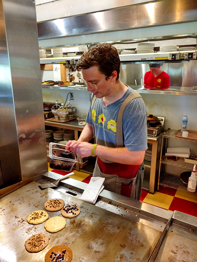 The pancake artist at work. Silver dollar-sized perfection takes shape before your eyes, each destined for breakfast immortality.