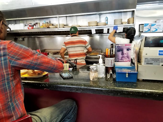 Where the magic happens&mdash;short-order cooks orchestrating breakfast symphonies with the practiced efficiency that only comes from years of experience. 