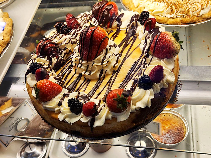 A cheesecake that doesn't just display berries &ndash; it celebrates them. This isn't dessert; it's an edible still-life painting with a graham cracker frame.