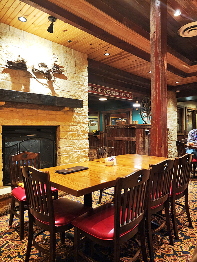 A table by the stone fireplace &ndash; the perfect spot to contemplate life's big questions, like "Should I order dessert?"
