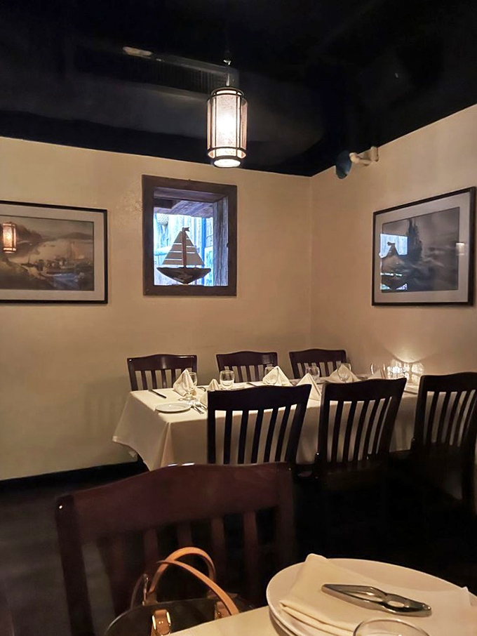 This intimate corner feels like your own private dining room at sea, complete with maritime art that transports you to distant shores.