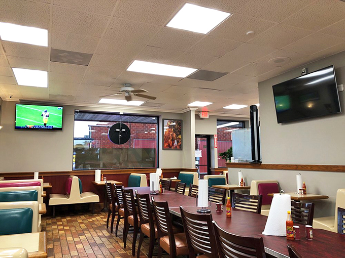 The dining room speaks in the universal language of "we're serious about seafood" with its practical design and sports on the TV.