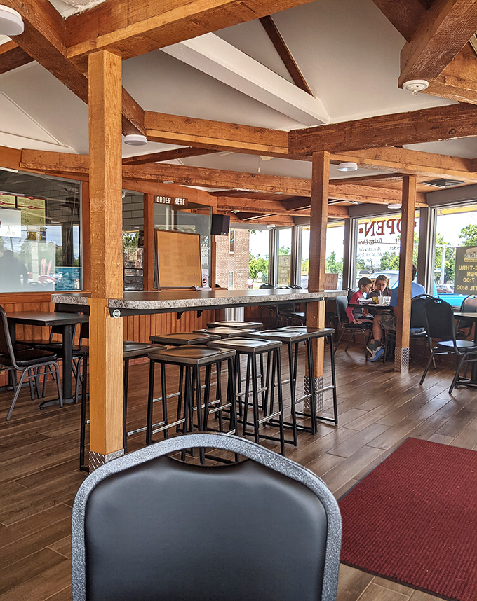 High-top tables and wooden beams create that perfect "stay awhile" atmosphere&mdash;because good sandwiches deserve to be savored, not rushed.